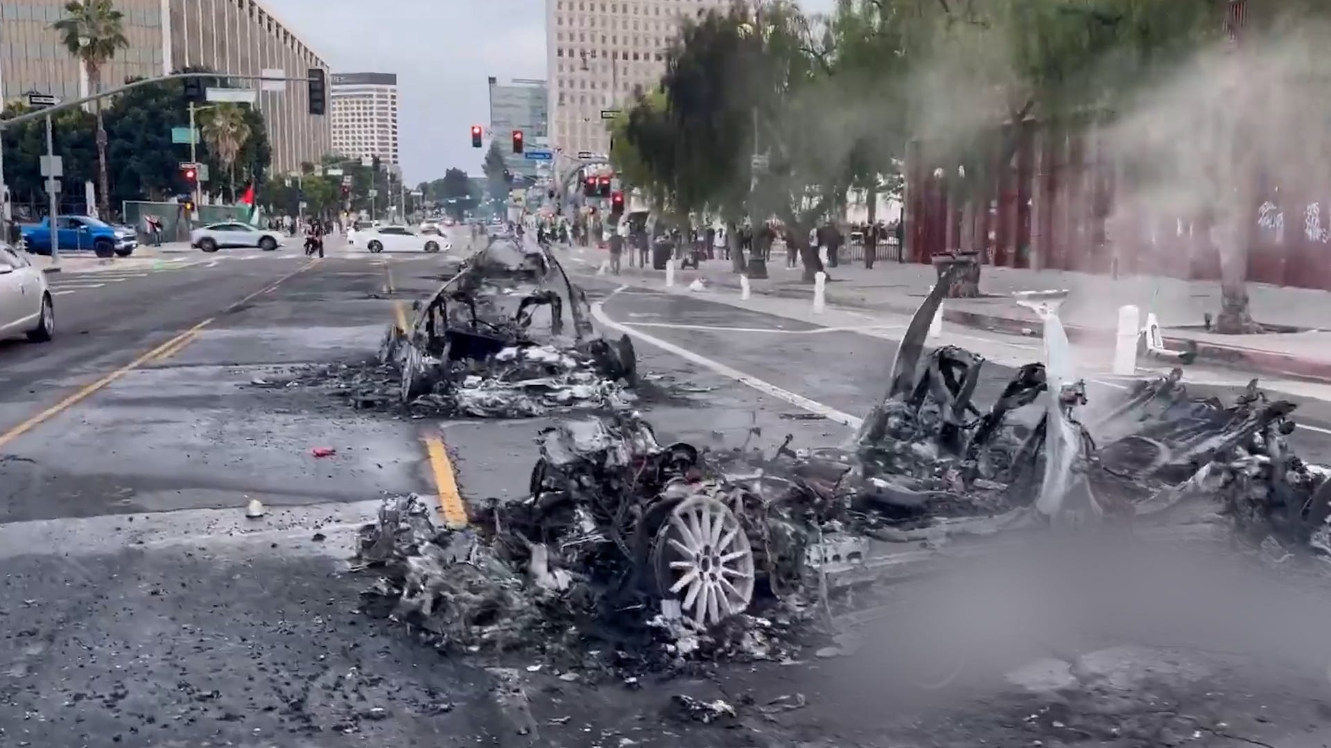 See burnt remains of Waymo cars lining Los Angeles street after protests