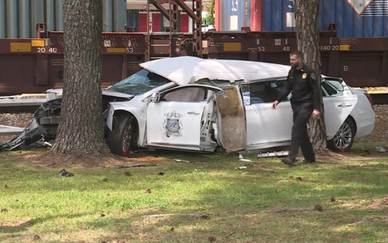 Funeral home limo driver, escorts cited in train collision that ‘mangled’ car