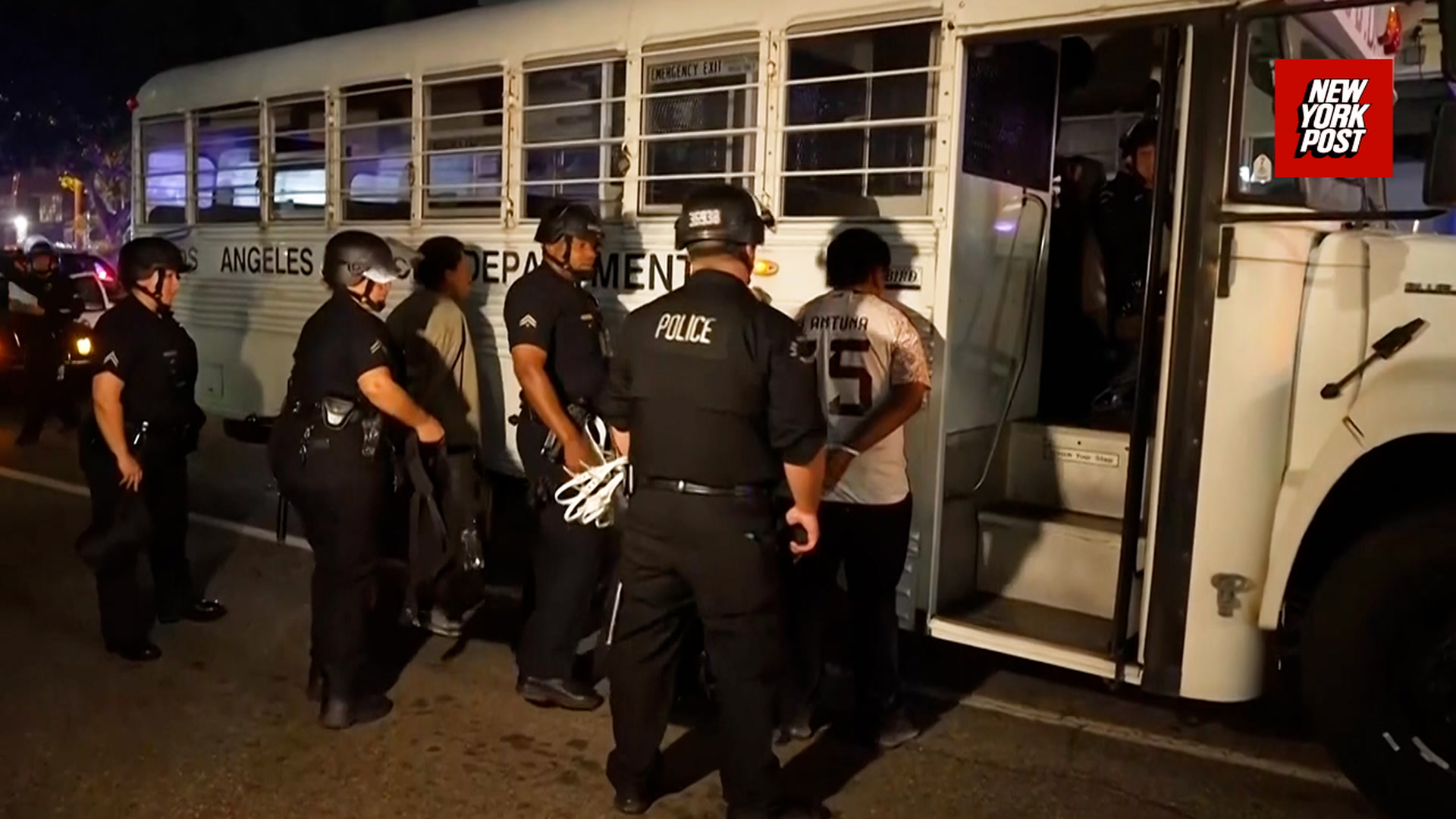 Zip-tied anti-ICE rioters herded into LAPD buses as police begin making ...