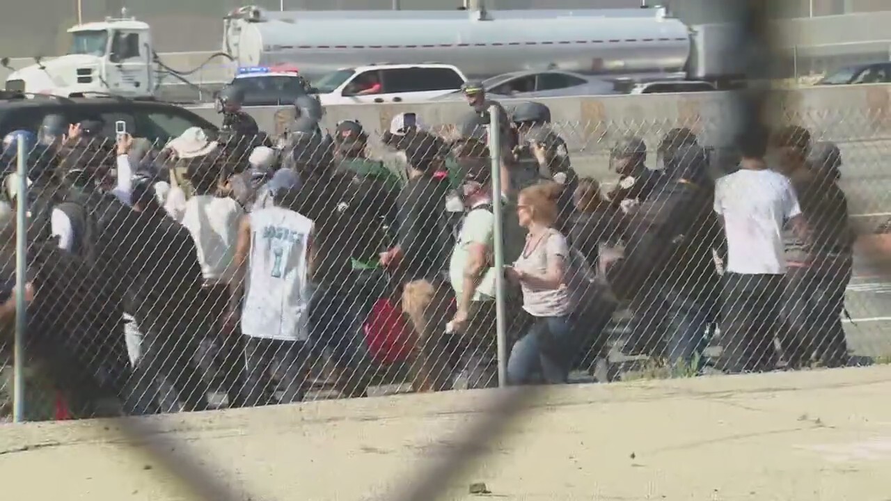 Protesters walk onto 101 freeway in downtown LA