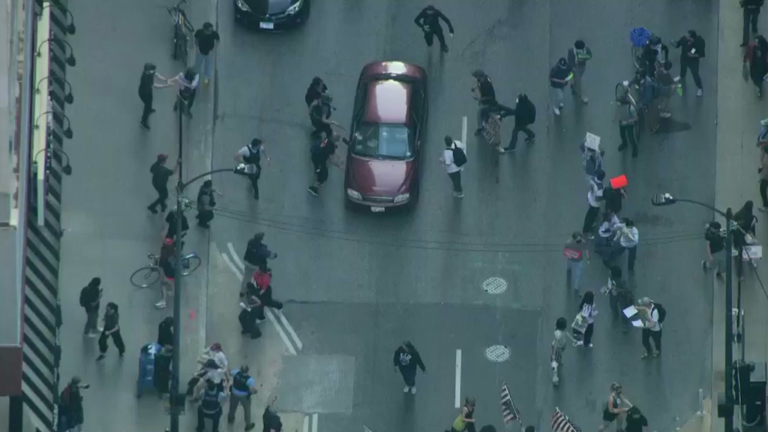 ICE protest draws thousands to Chicago Loop; car plows through early on