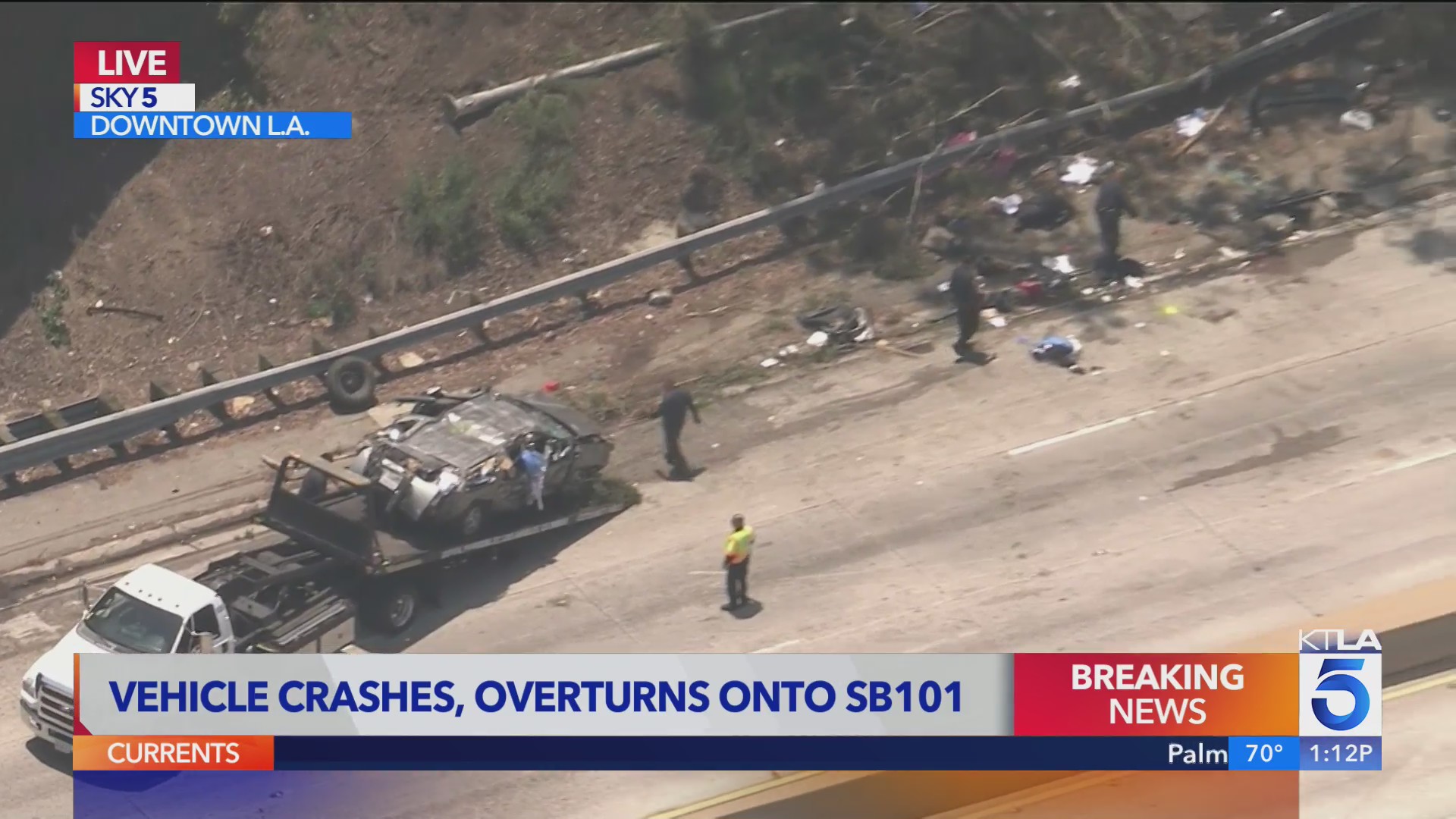 2 in 'at least serious condition' after car flies off freeway ...