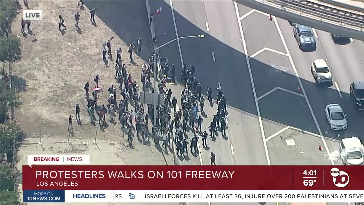 LA protesters walk on 101 freeway