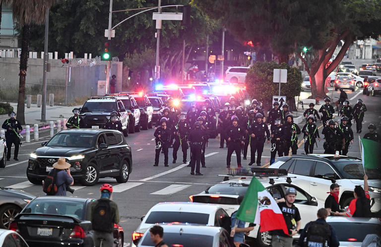 Nighttime curfew in LA as Trump vows to 'liberate' city