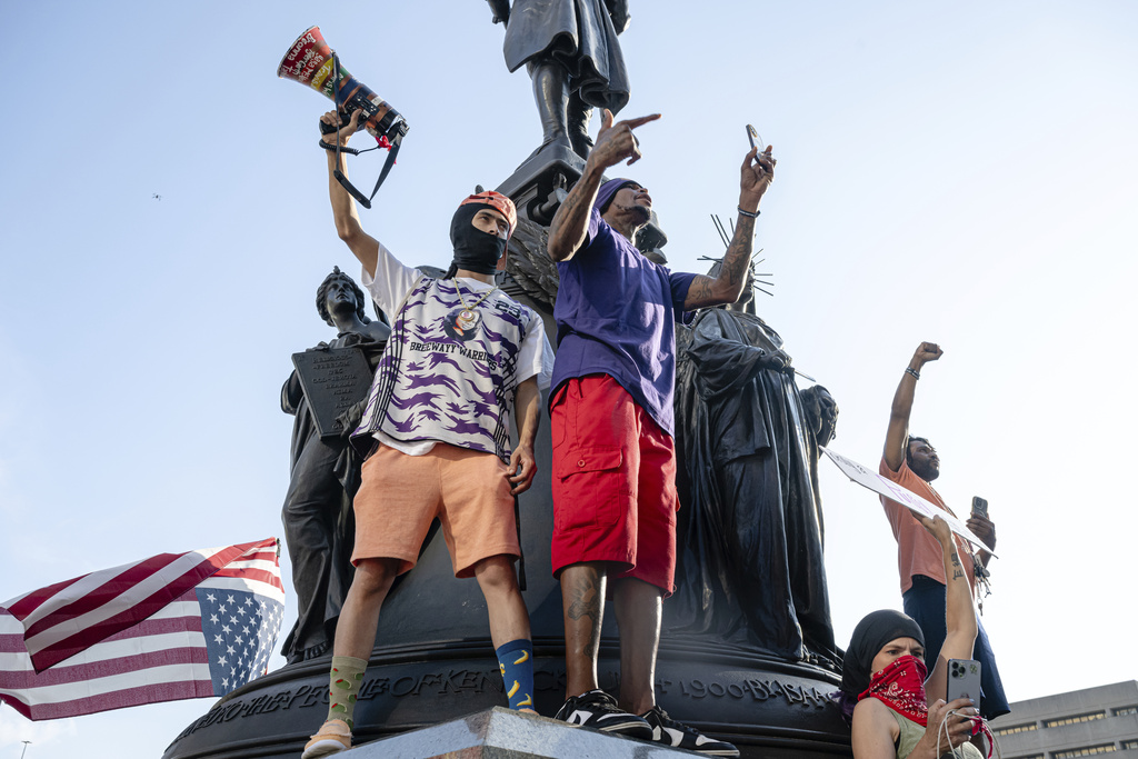 AP PHOTOS: Protests over immigration raids spread beyond Los Angeles