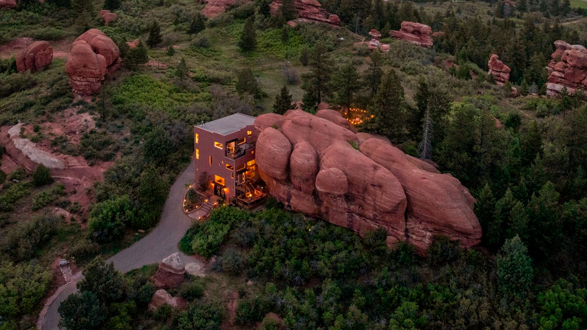 Flintstones-like home built around a 200 million-year-old red rock for ...