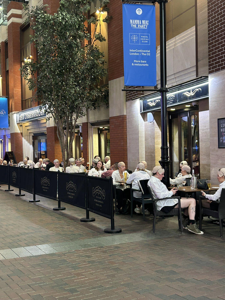 Fans are wearing bald caps to Pitbull shows, and he's into it