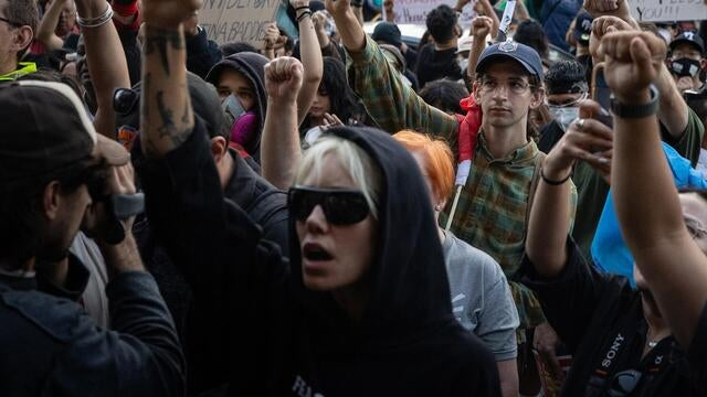 Protests against immigration raids spread across U.S.