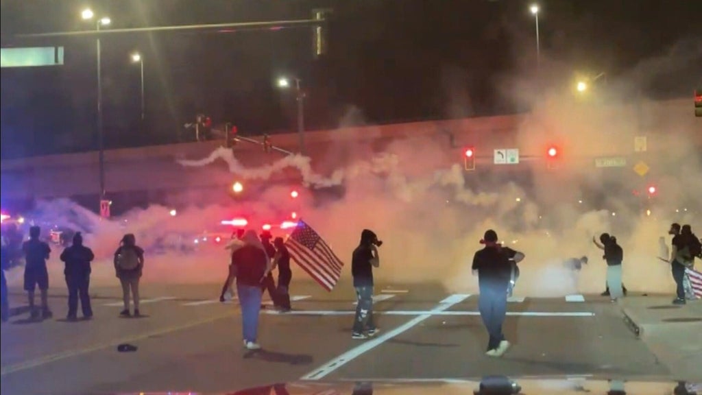 Denver police confront marchers upset with ICE in chaotic exchanges ...