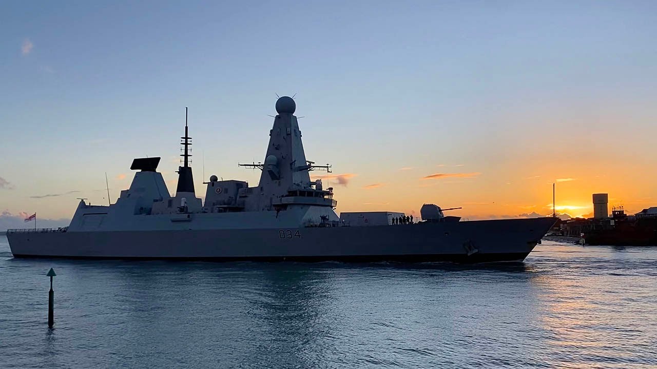 HMS Diamond returns home at sunset
