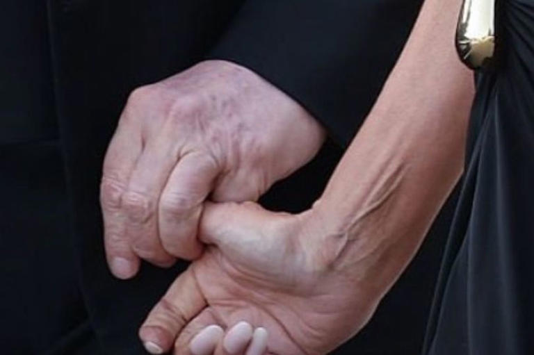 Trump's wrinkled hand 'shows real age' as he weirdly grips Melania's ...
