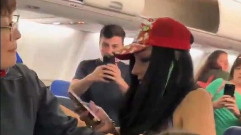 Shocking video shows drunk passenger grabbing woman's hair, spitting on ...