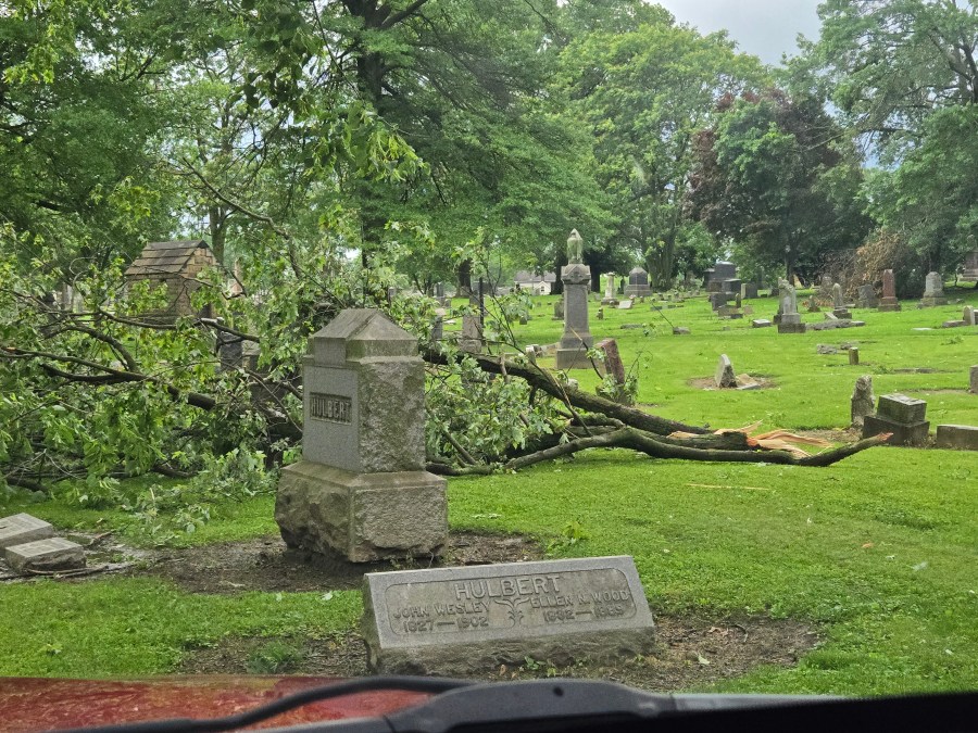 LOOK: Winds tip over semi, damage cemetery