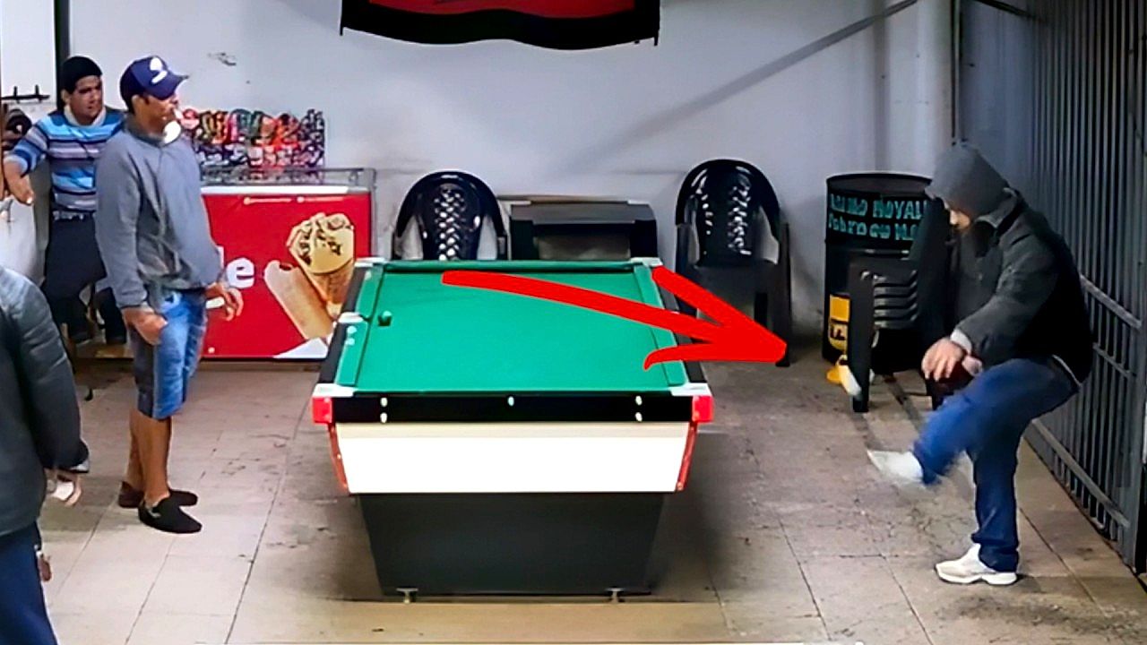 Man makes incredible pool shot by kicking ball back onto table