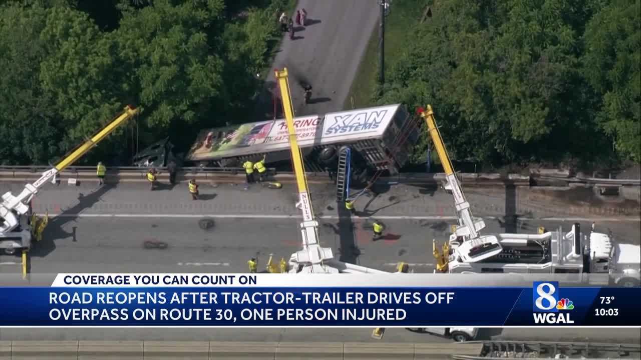 Tractor-trailer goes over guardrail, left hanging from Route 30 bypass