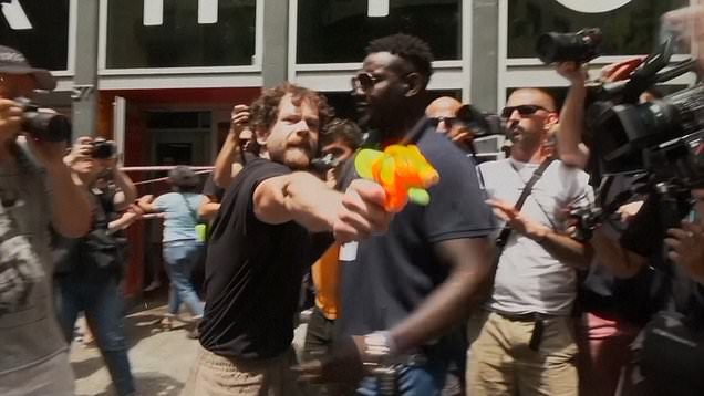 Hotel worker fights back against crowd of anti-tourism protesters