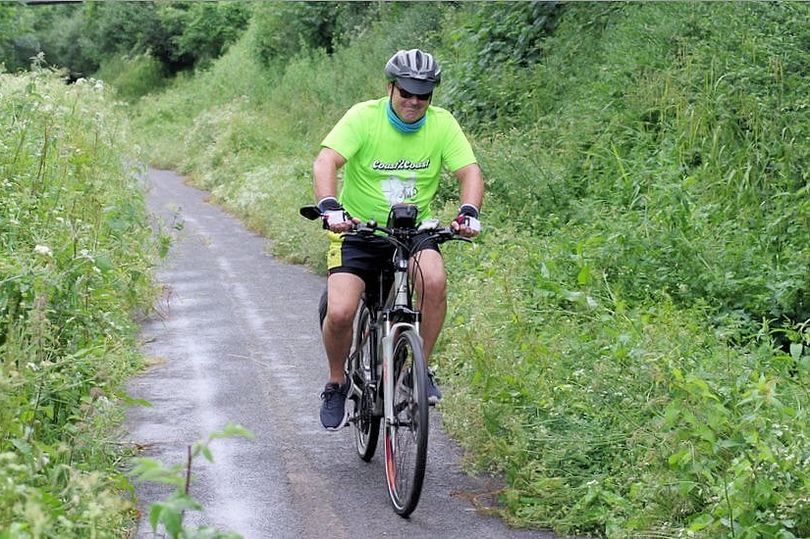 Tearful tribute as Devon cyclists finish Buster's journey