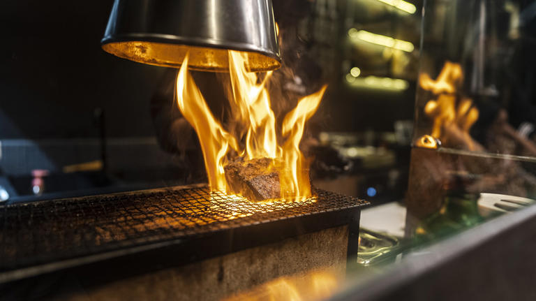 Here's Why Steakhouse Dining Is So Expensive