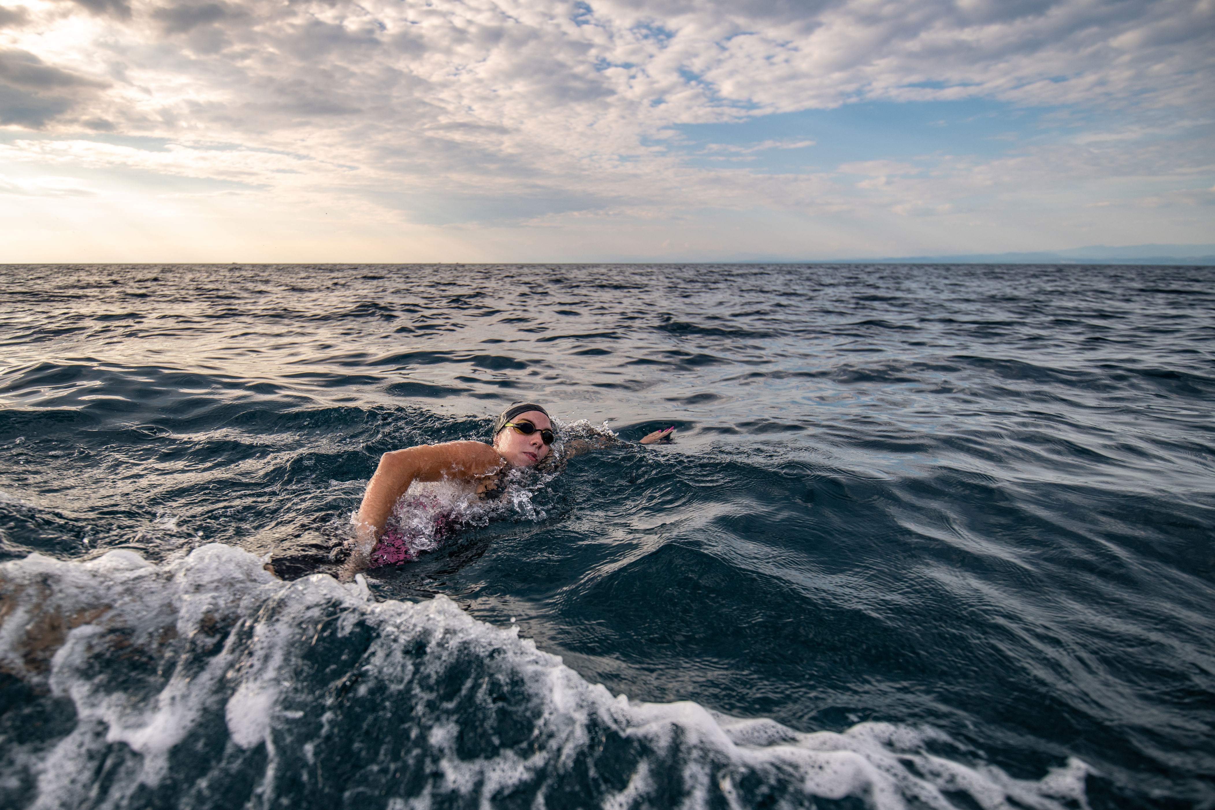 Open-ocean swimming has many health benefits — and some risks