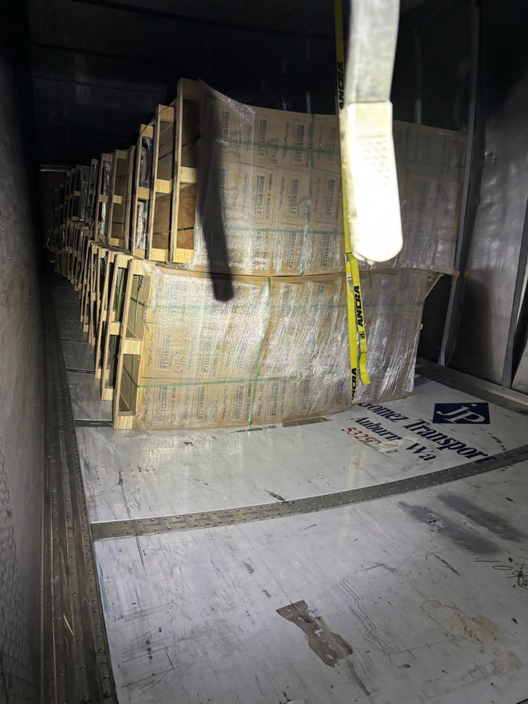Semi-truck transporting 10,000 bottles of whiskey tips over on highway ...