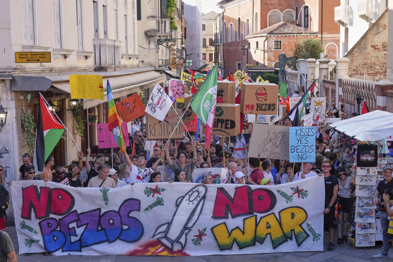 ‘Kisses yes, Bezos No,’ protesters say, as Bezos wedding bonanza stirs ...