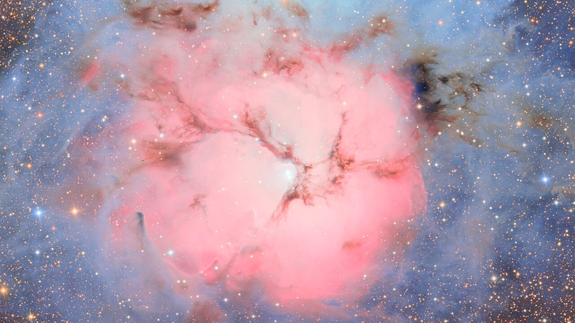 A cotton candy nebula glows in Vera C. Rubin Observatory's first close ...