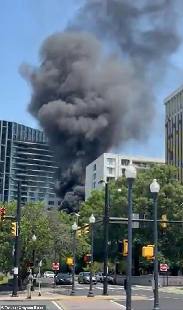 Car explodes in Washington DC as black smoke billows through sky