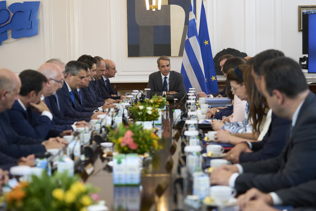 A hard-right lawmaker is sworn in as Greece's migration minister