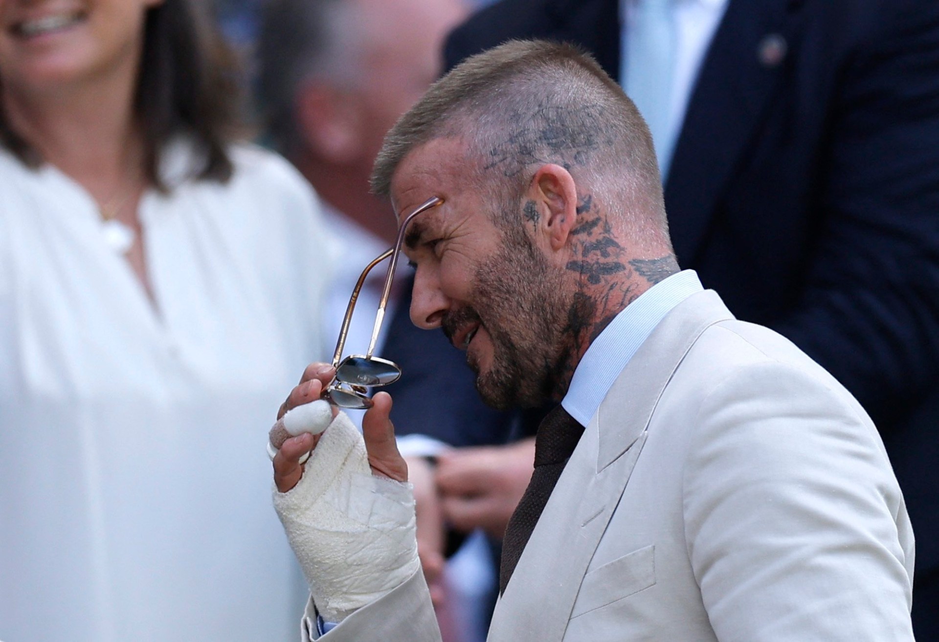 David Beckham spotted at Wimbledon post-surgery