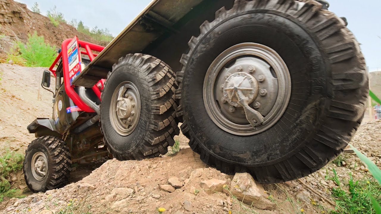 Massive 6x6 Truck Powers Up Hill at Full Throttle.
