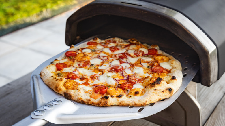 Thinking Of Buying A Pizza Oven? Here's How To Decide If It's Worth It