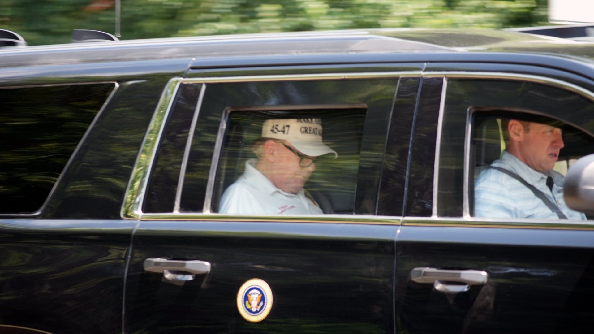 Donald Trump caught wearing glasses and reading paper