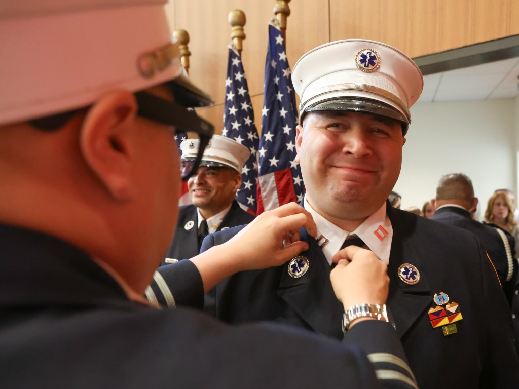 FDNY promotes 84 at EMS ceremony, including hero dad awarded for cop rescue