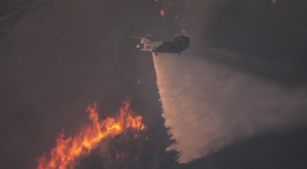 Evacuation orders remain as crews continue battling Wolf Fire near Banning