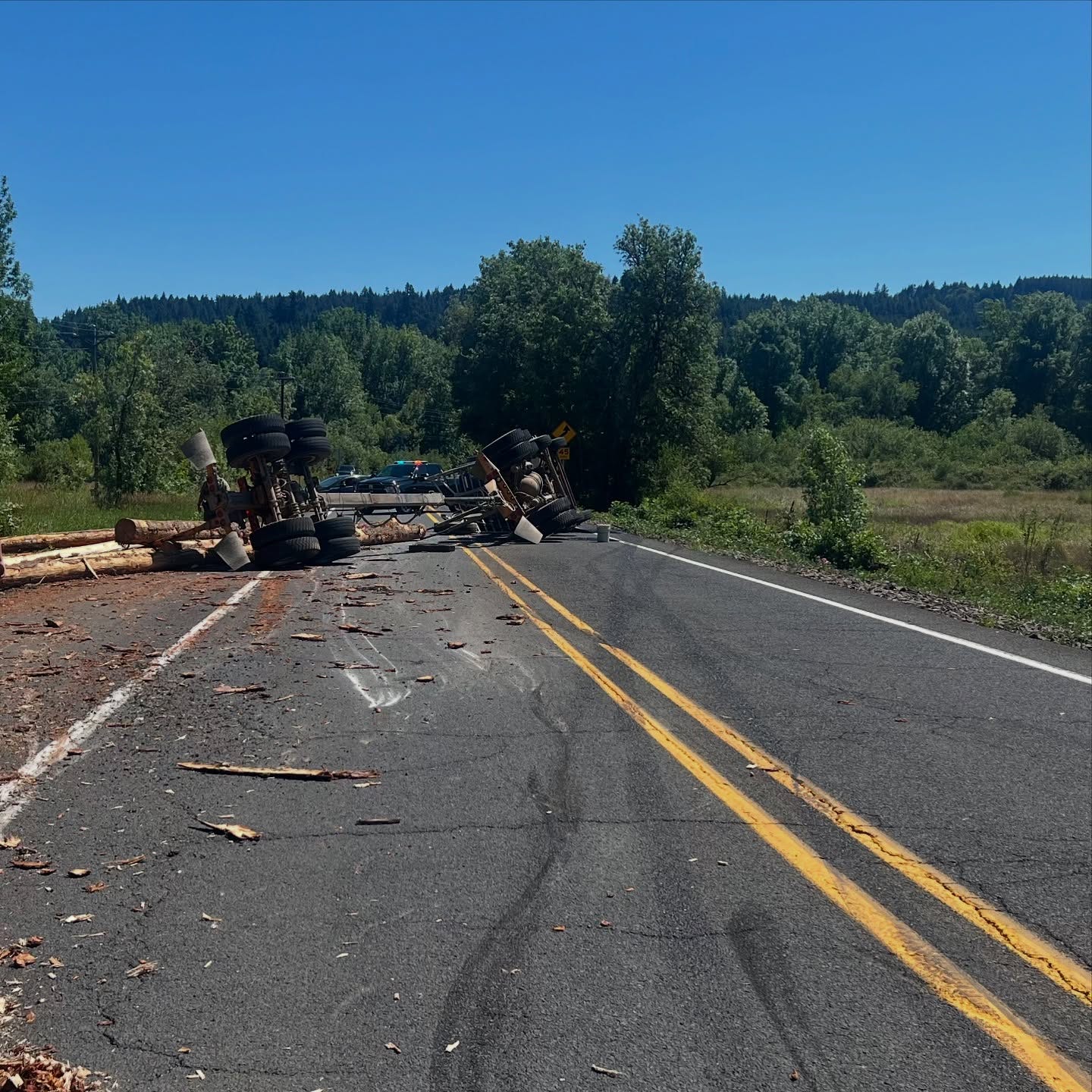 One injured in log truck crash that closed Territorial highway ...