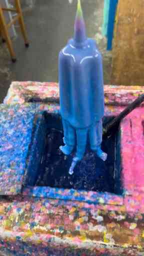 Close-Up Candle Dipping With Steady Pour