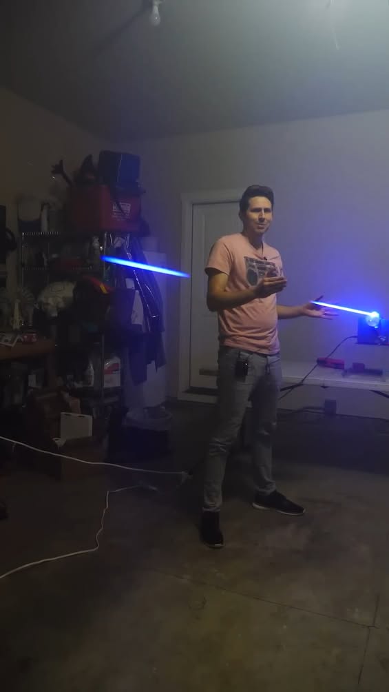 Laser blaster blasts guy in garage