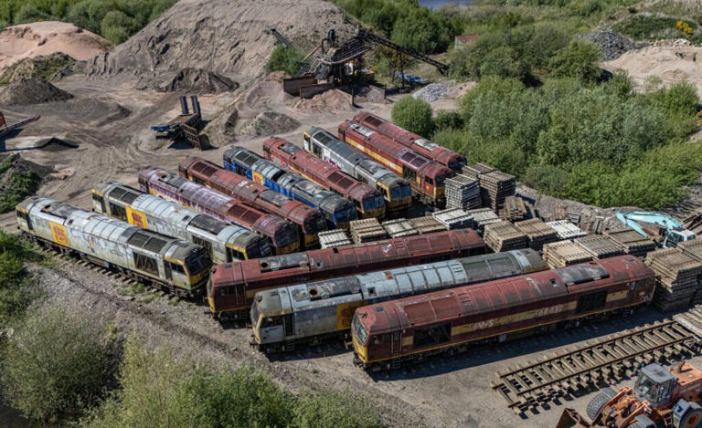 Eerie aerial photos reveal abandoned trains hidden in a remote quarry