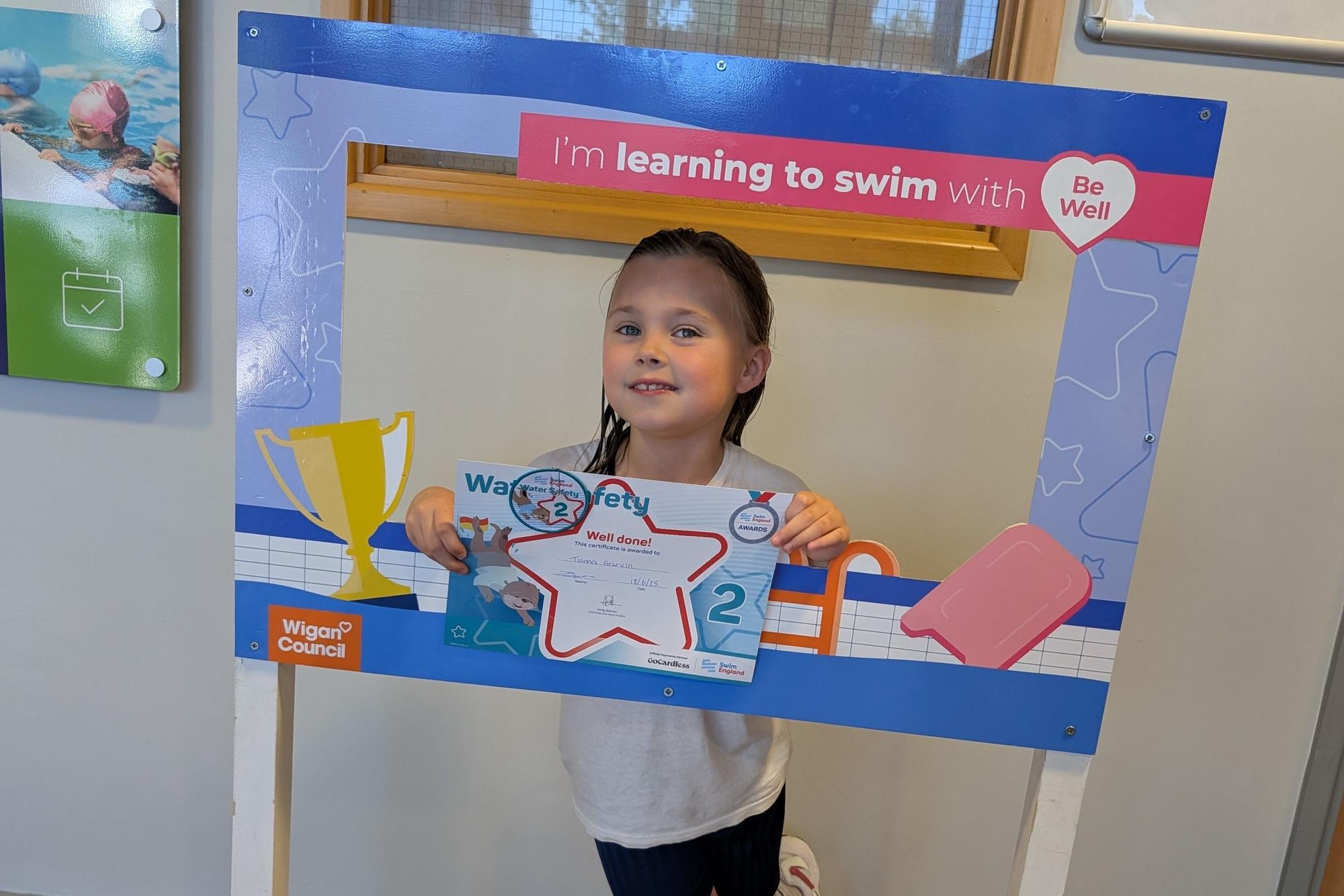 Girl aged 7 swims five miles to help Wigan homeless