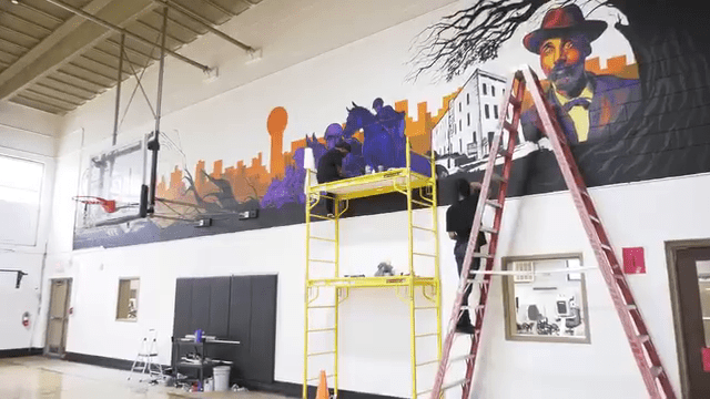 Father-son duo paint mural at Knoxville’s Cal Johnson Recreation Center