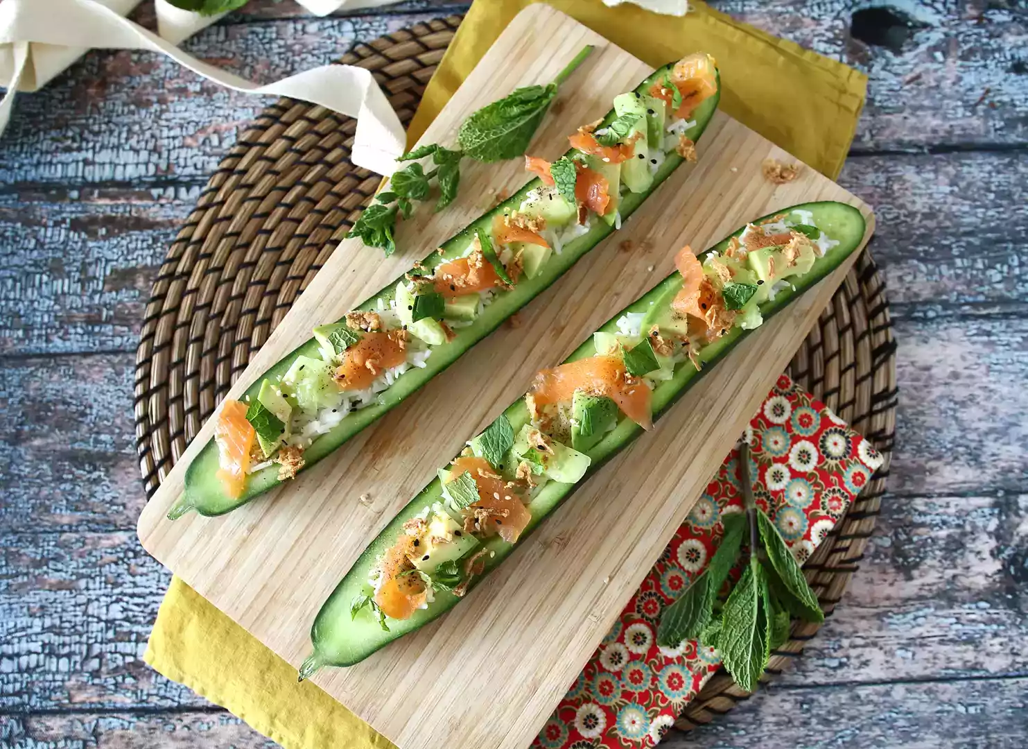 Cucumber boats with salmon, avocado and rice