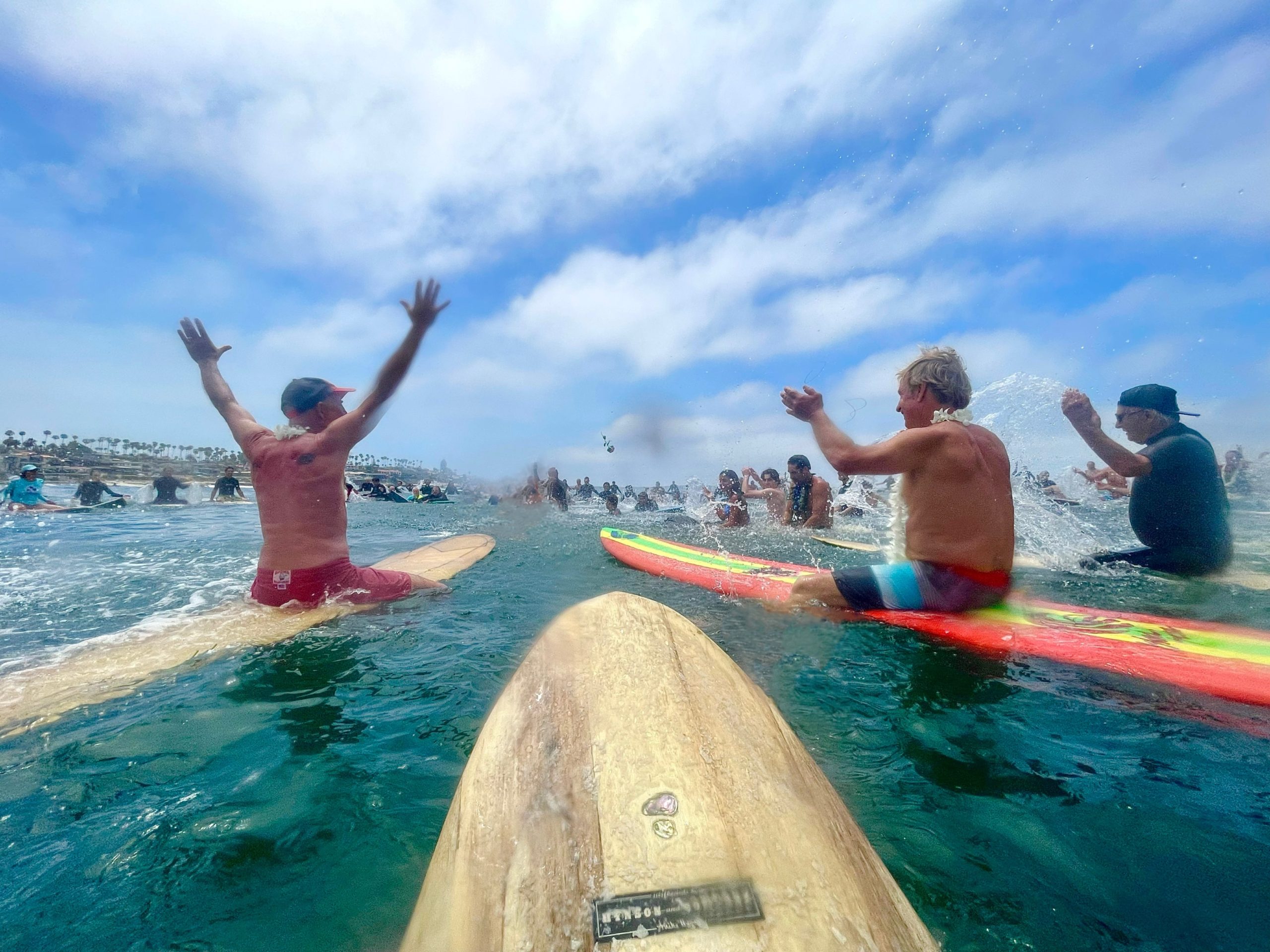 Surfers pay tribute to Mike Hynson with paddle out in La Jolla