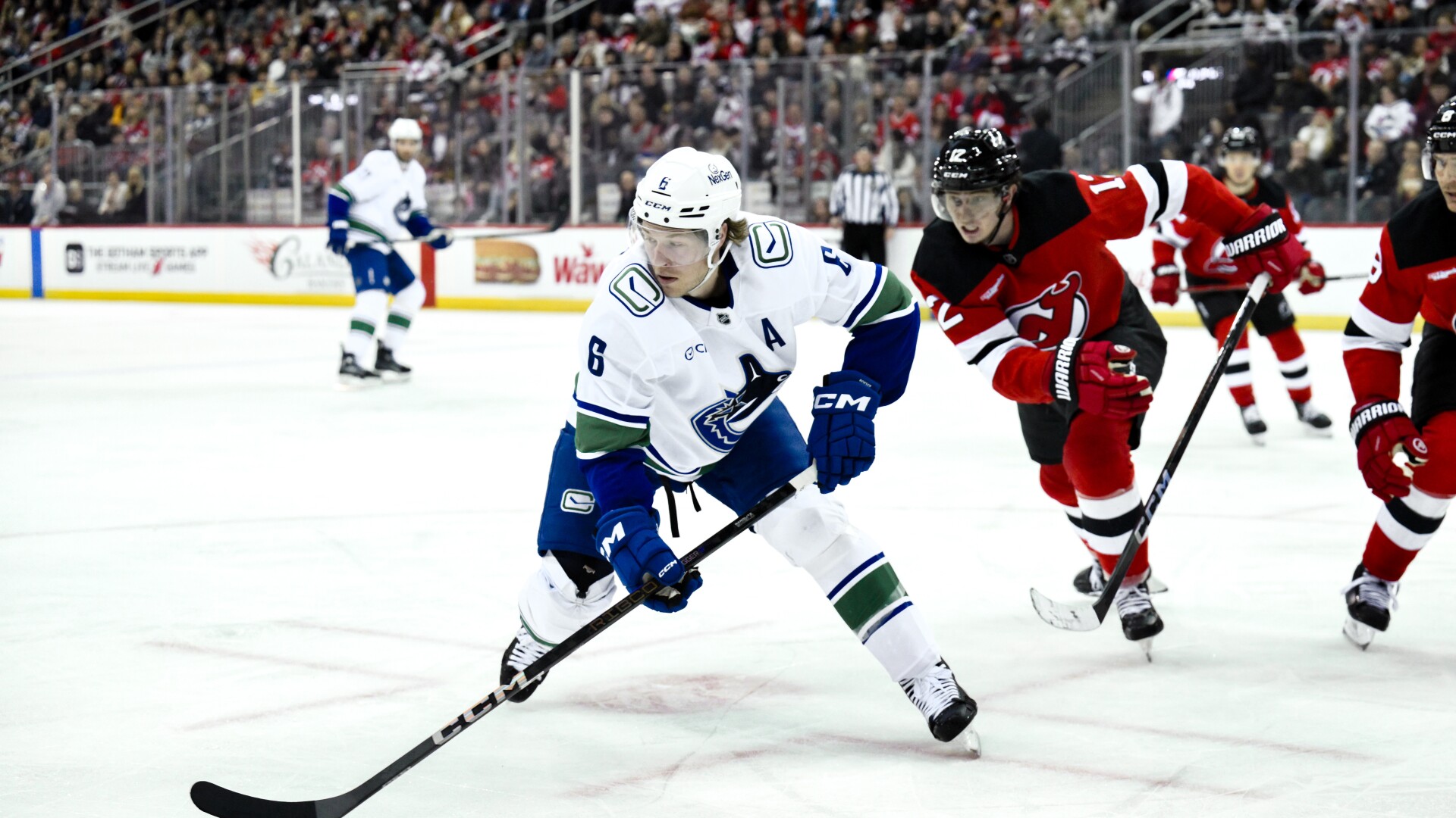 Canucks re-sign Boeser, Rangers land Gavrikov and Devils keep goalie ...