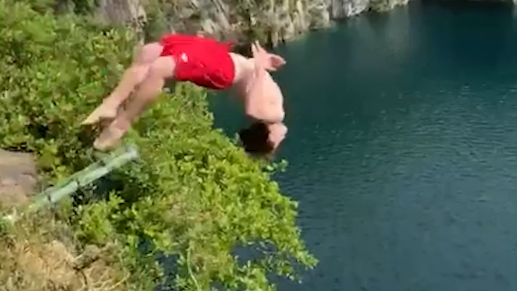 Cliff jumping adventures into a scenic quarry