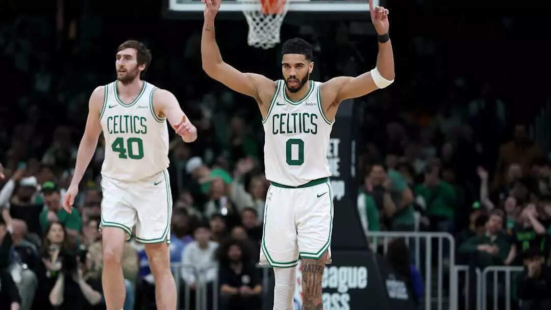 Boston Celtics stars Jayson Tatum and Kristaps Porziņģis bear no ill ...