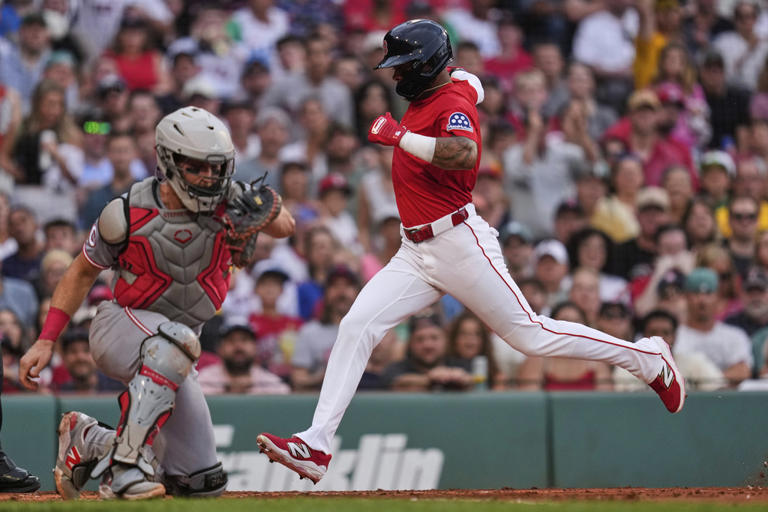 Encarnacion-Strand hits his 1st career grand slam to power Reds' rally ...