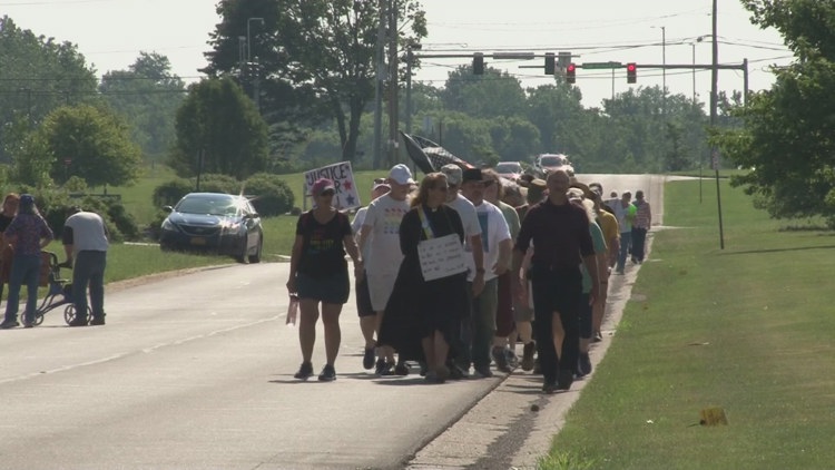 Activist ends 78-mile walk with protest at Batavia ICE detention center