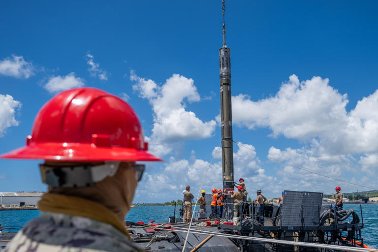 Photos show US submarine loading cruise missiles at frontline Pacific base