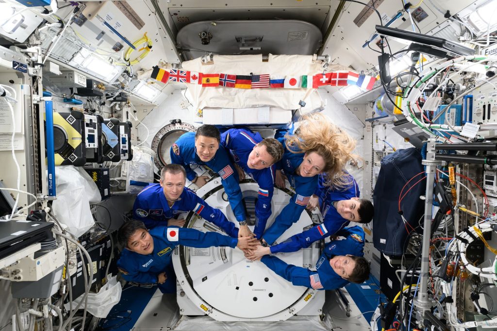 Astronauts show off creative poses in space station photos