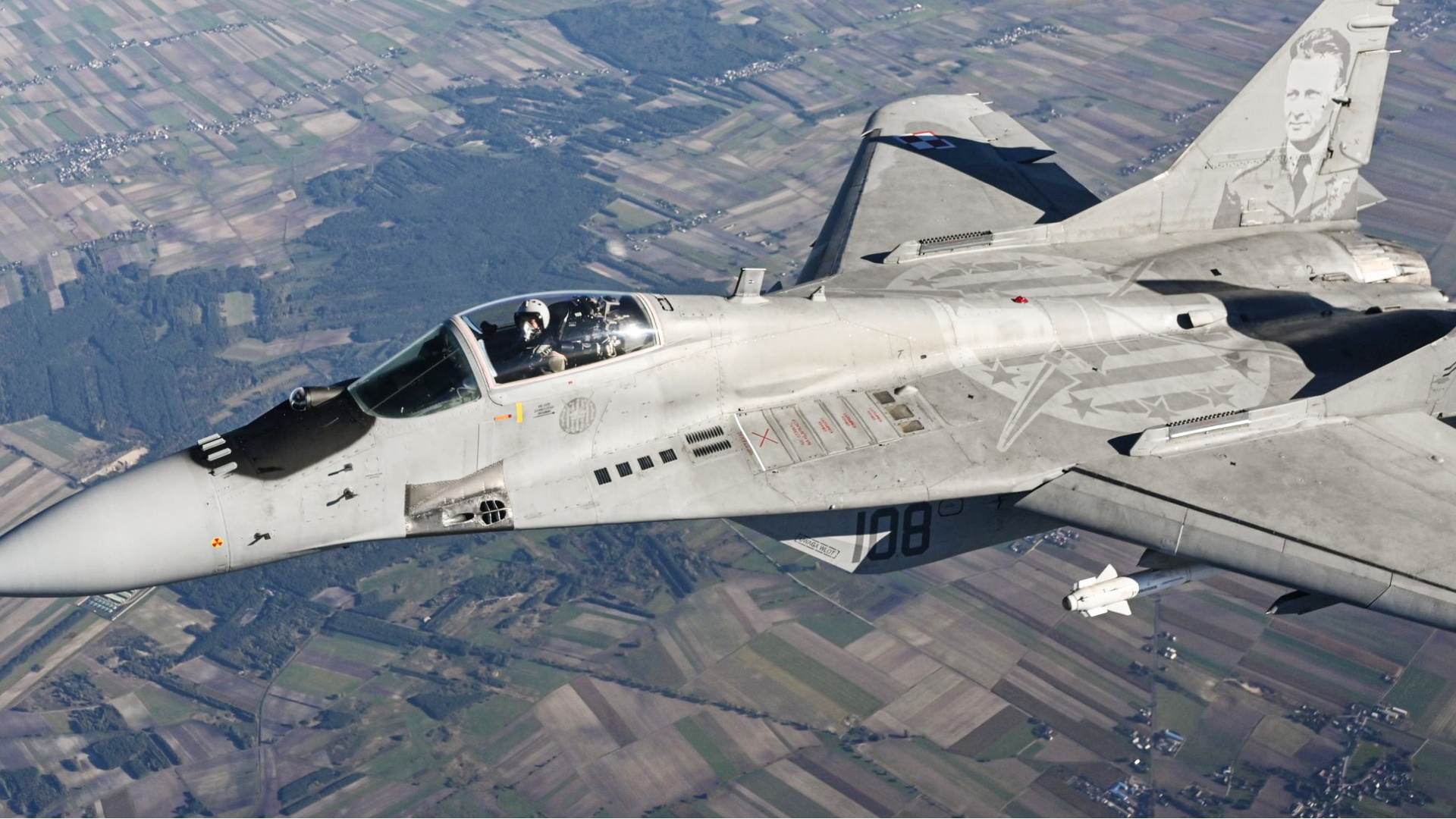 Russian military pilot is shown descending by parachute after his ...